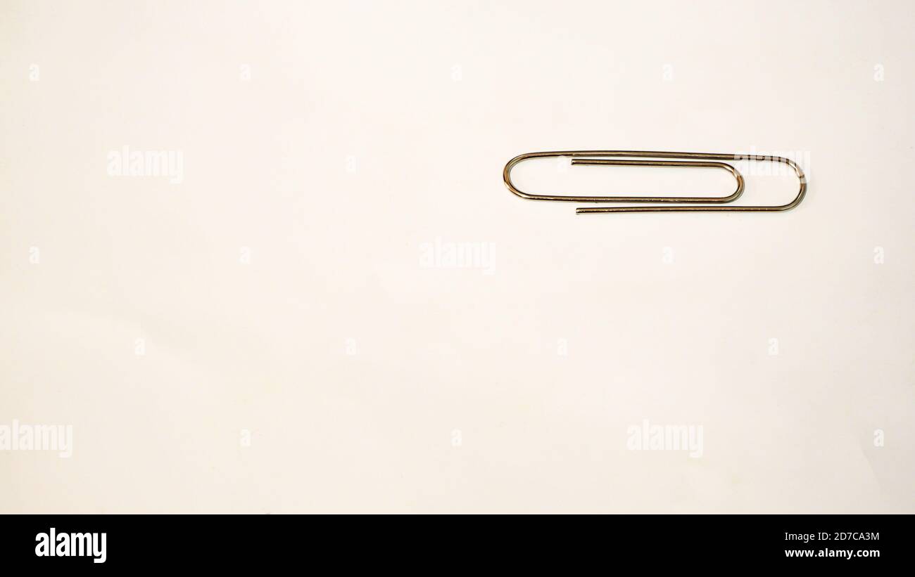 Paper clip with white background Stock Photo - Alamy