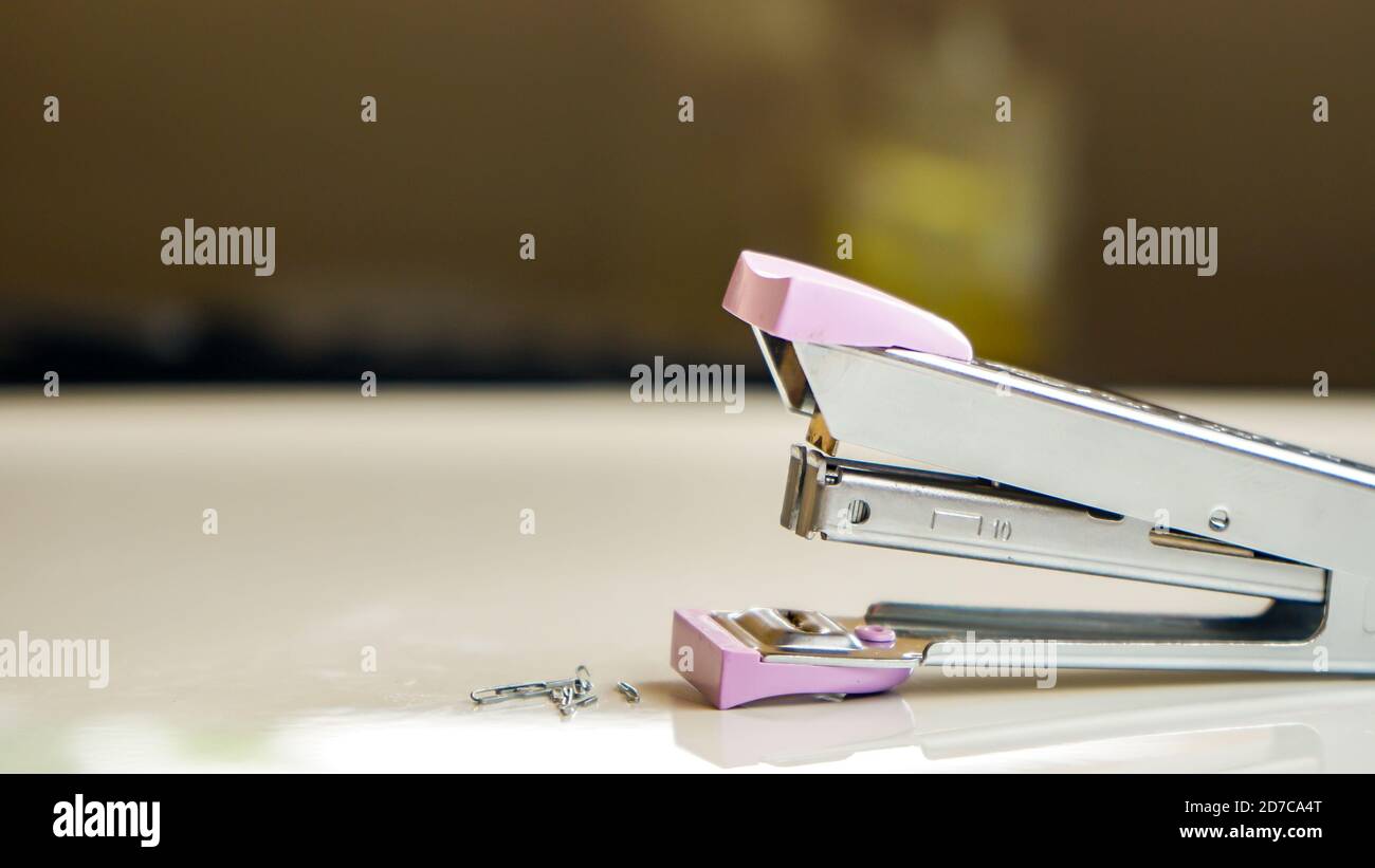 Close up the stapler on the table Stock Photo - Alamy