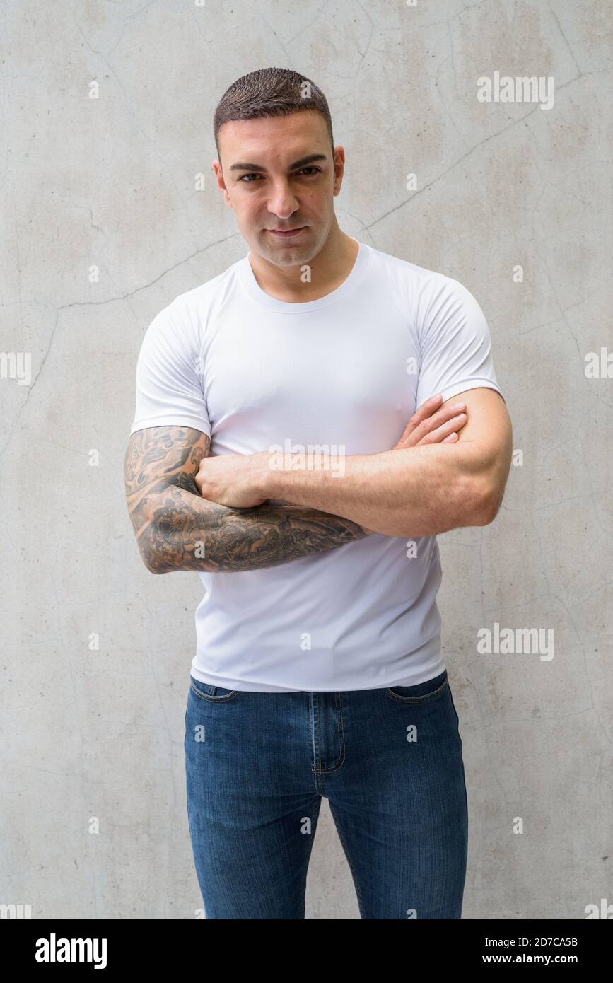 Portrait of handsome man with arms crossed Stock Photo - Alamy