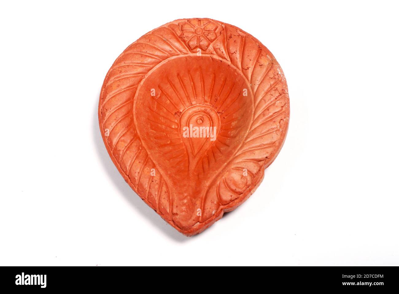 A close up of a beautifully designer handmade clay lamp isolated on ...