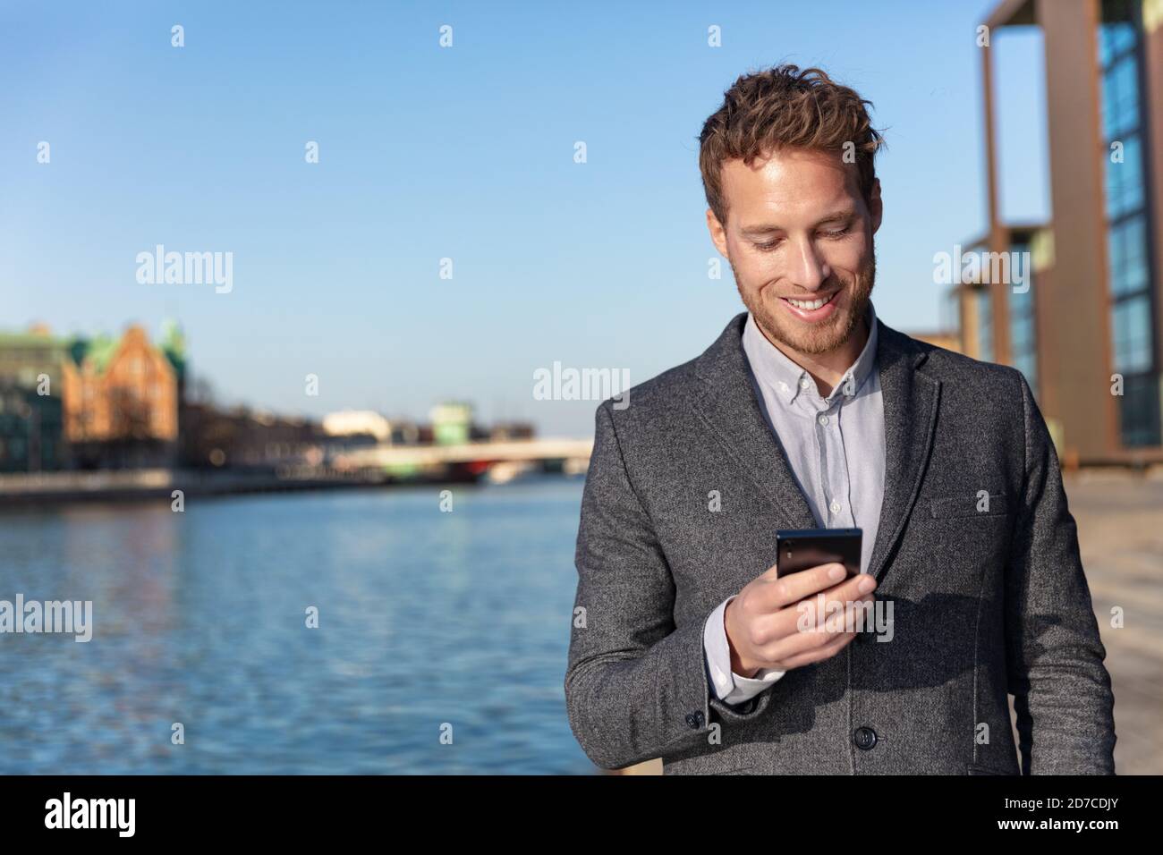 Business man texting on mobile phone using app for sms text message 5g ...