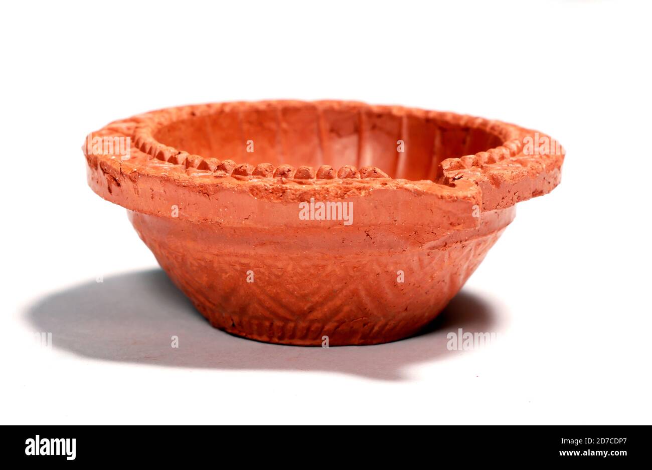 A close up of a beautifully designer handmade clay lamp isolated on ...