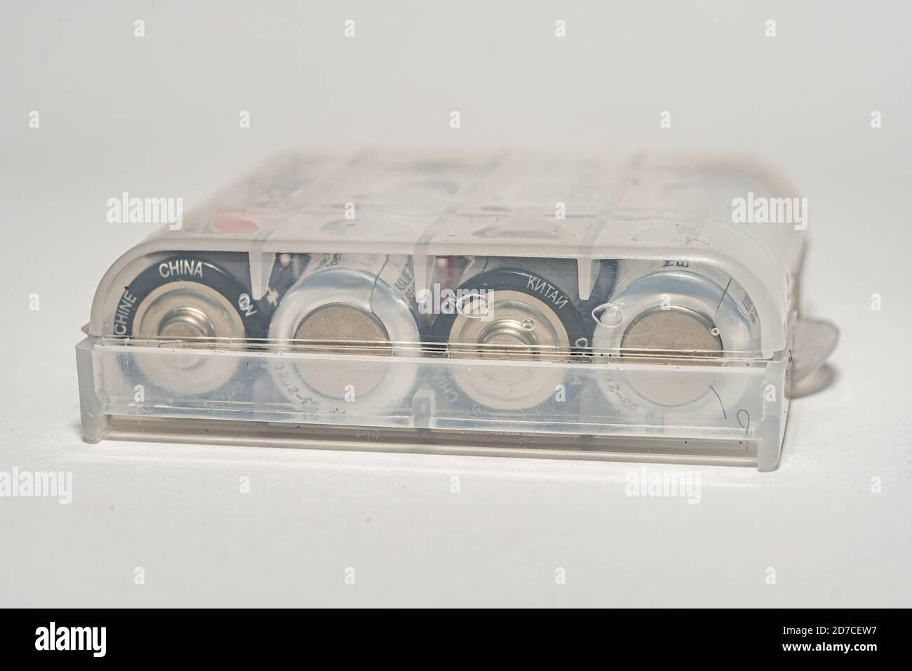 Batteries in a transparent box isolated on a white background Stock ...