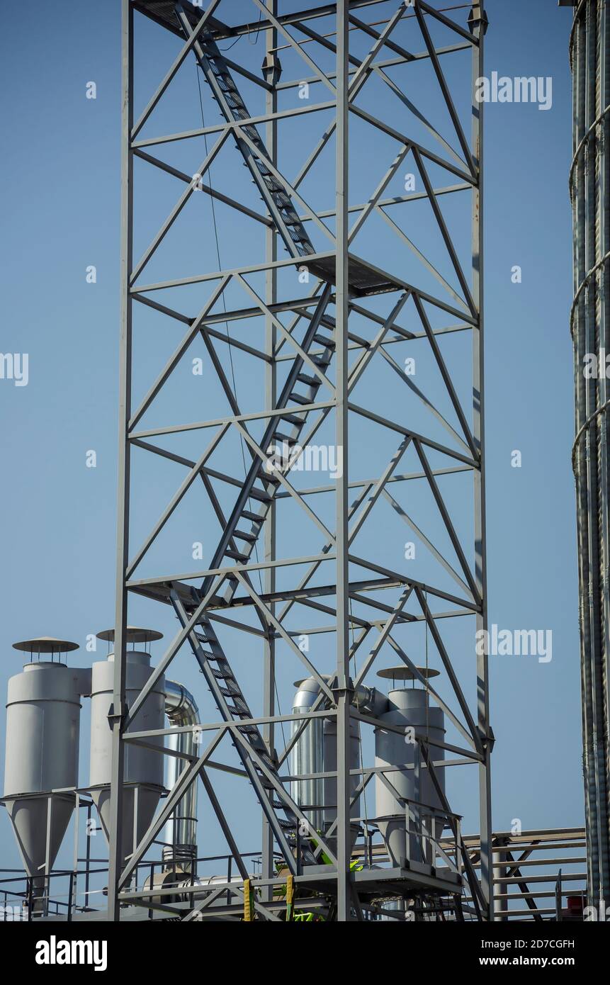 High rectangular steel structure with stairs against the sky. Gray ...