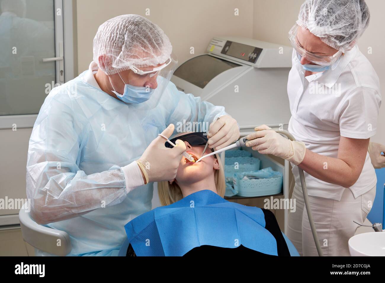 Dentist making local anesthesia shot before surgery Stock Photo - Alamy