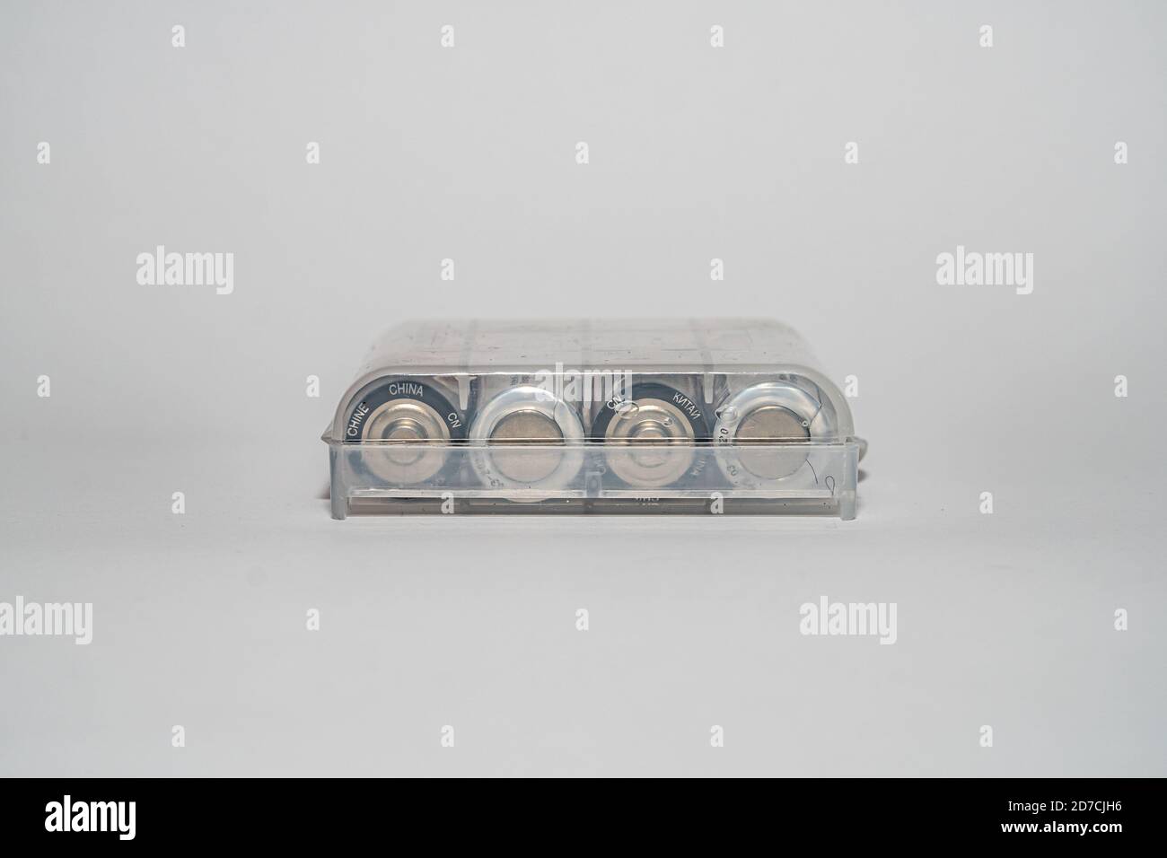 Batteries in a transparent box isolated on a white background Stock ...