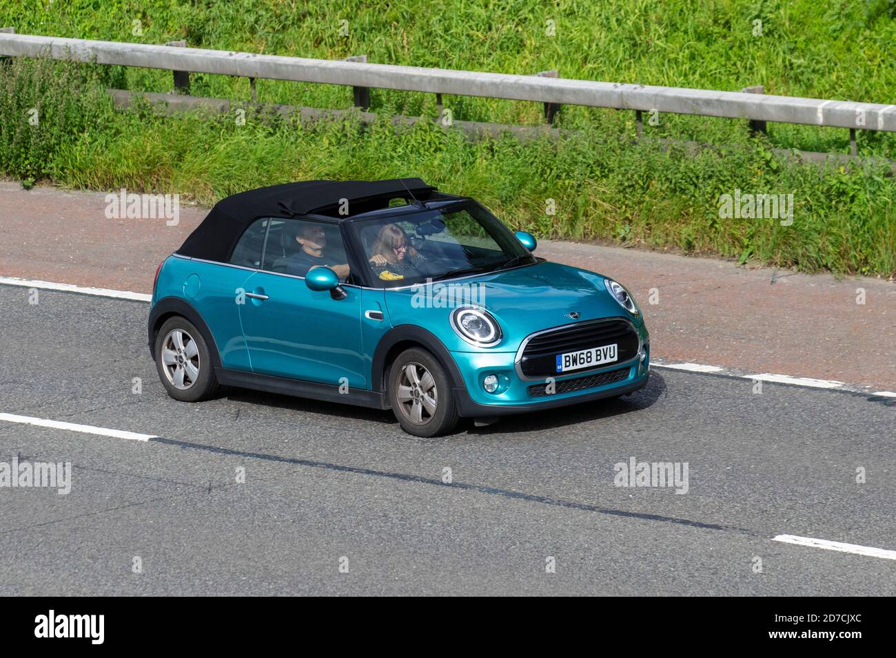 2018 (68) Turquoise Mini Cooper Classic; Vehicular traffic, moving ...