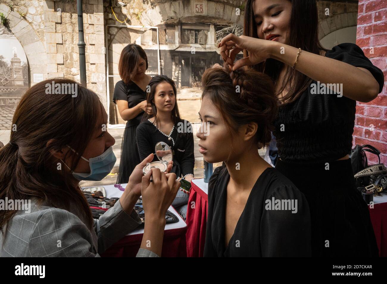 Young women getting made up for a modeling event, Pho Bich Hoa Phung ...