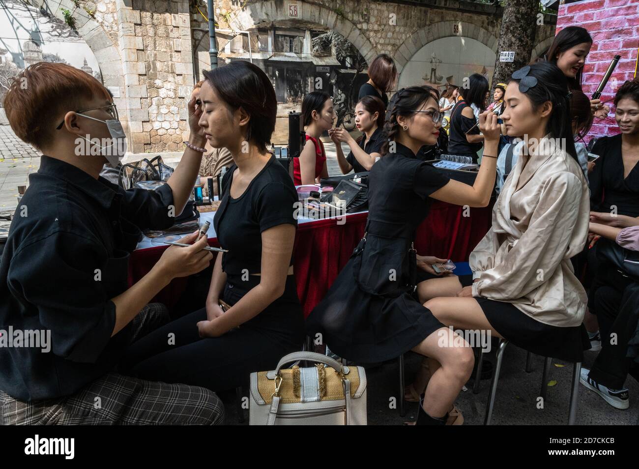 Young women getting made up for a modeling event, Pho Bich Hoa Phung ...