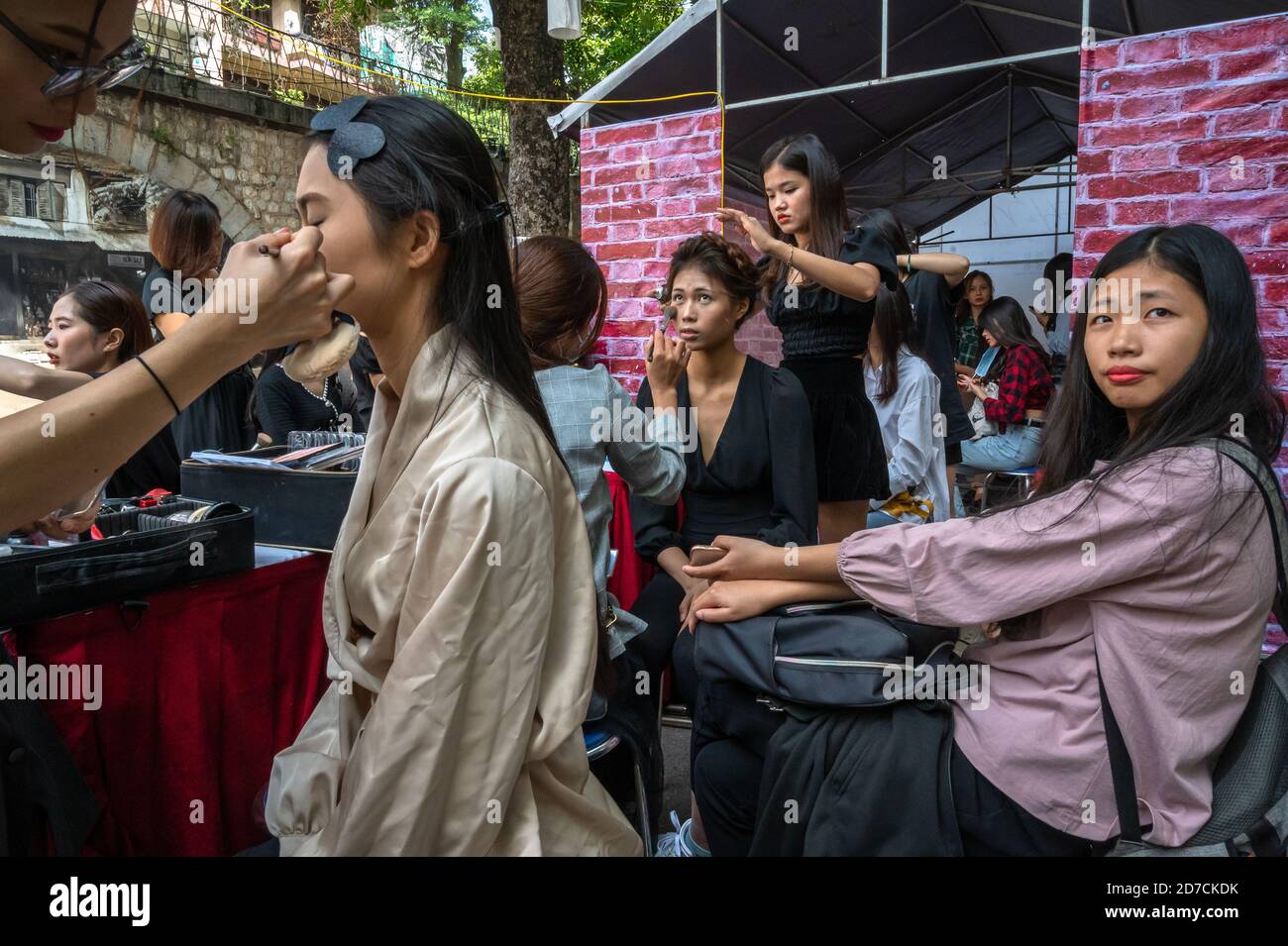 Young women getting made up for a modeling event, Pho Bich Hoa Phung ...