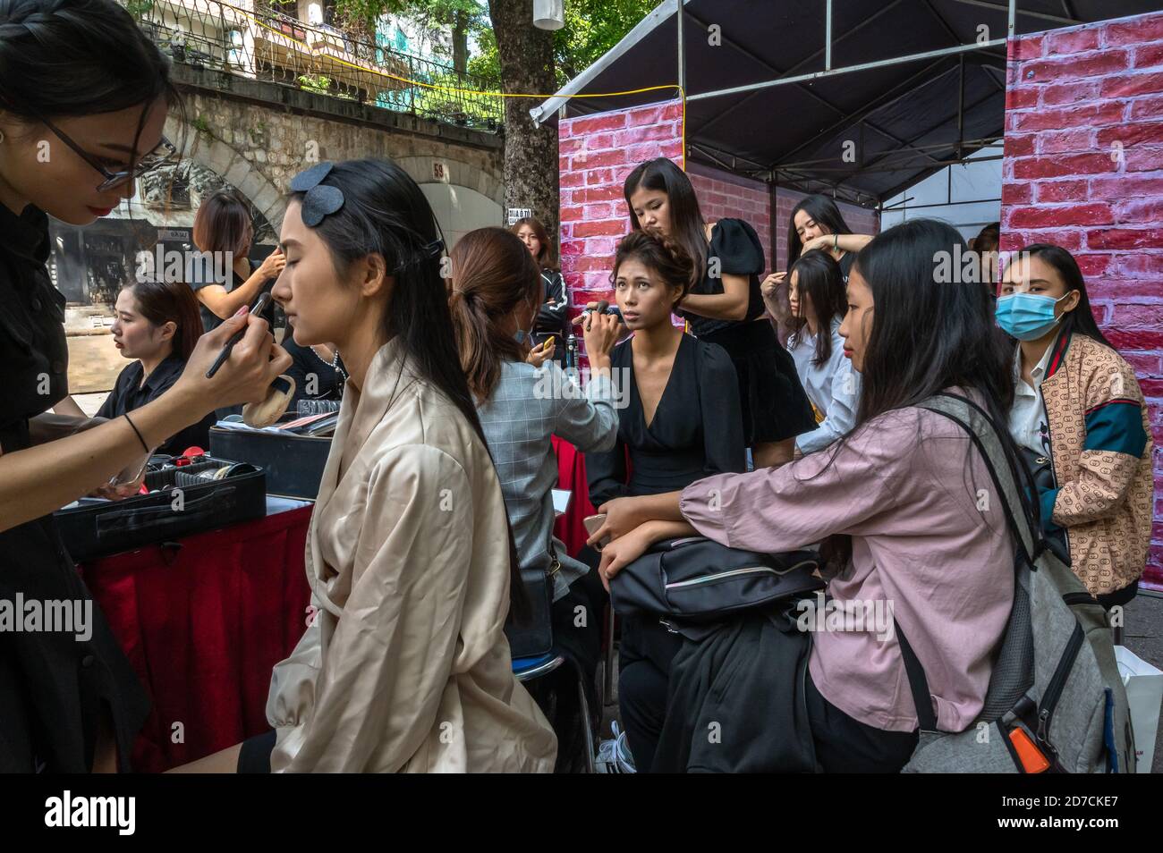 Young women getting made up for a modeling event, Pho Bich Hoa Phung ...