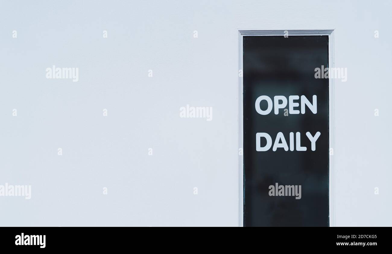 restaurant opening sign on white wall Stock Photo - Alamy