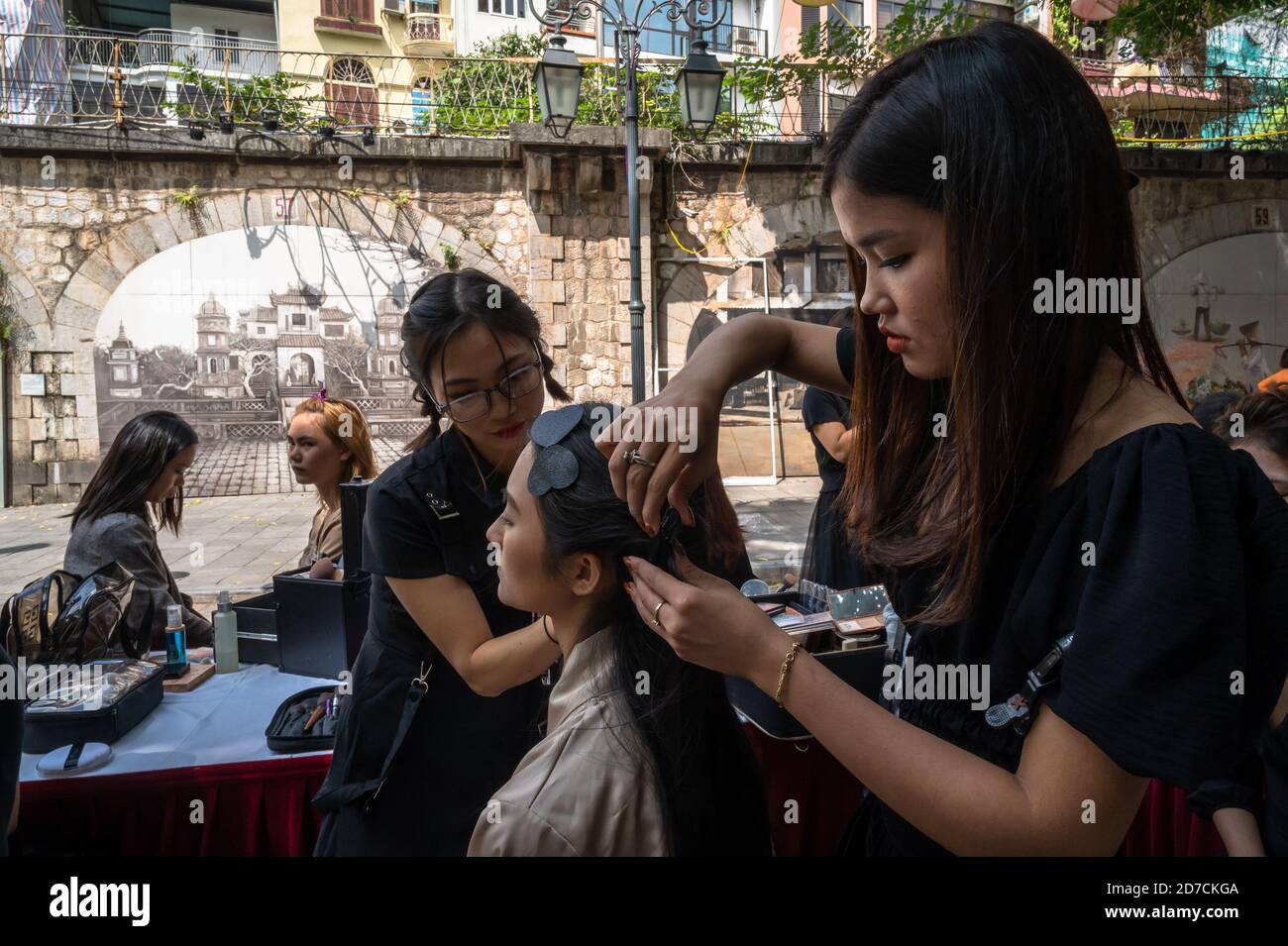 Young women getting made up for a modeling event, Pho Bich Hoa Phung ...