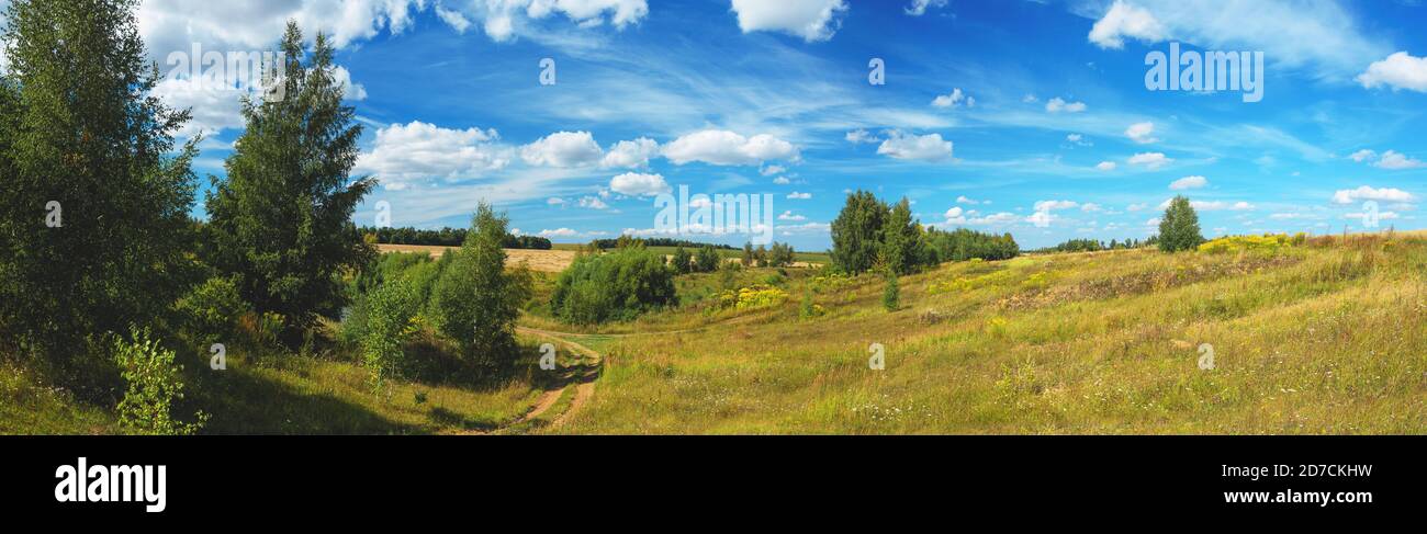 Bright summer rural russian landscape with country road and fields ...
