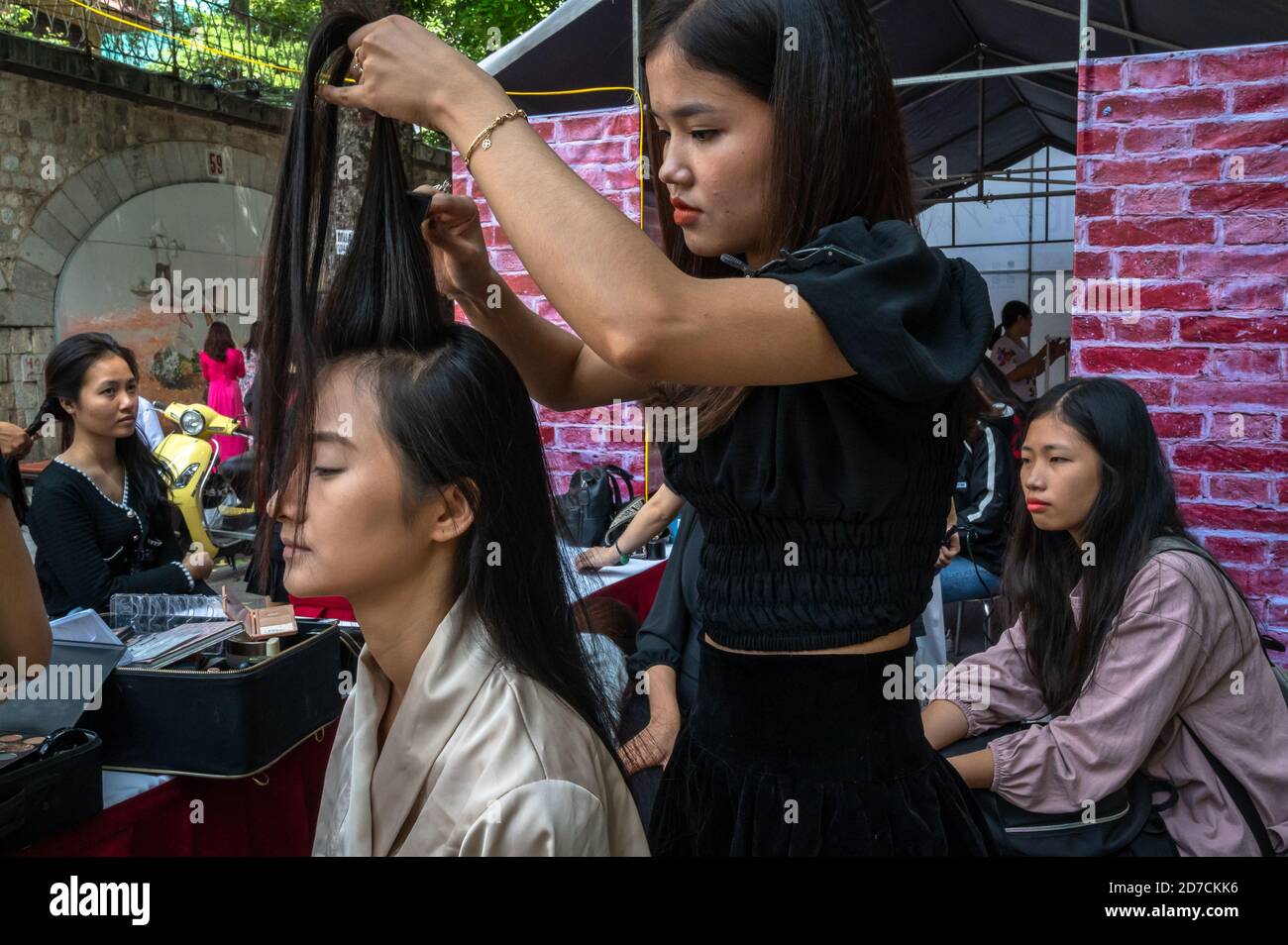 Young women getting made up for a modeling event, Pho Bich Hoa Phung ...