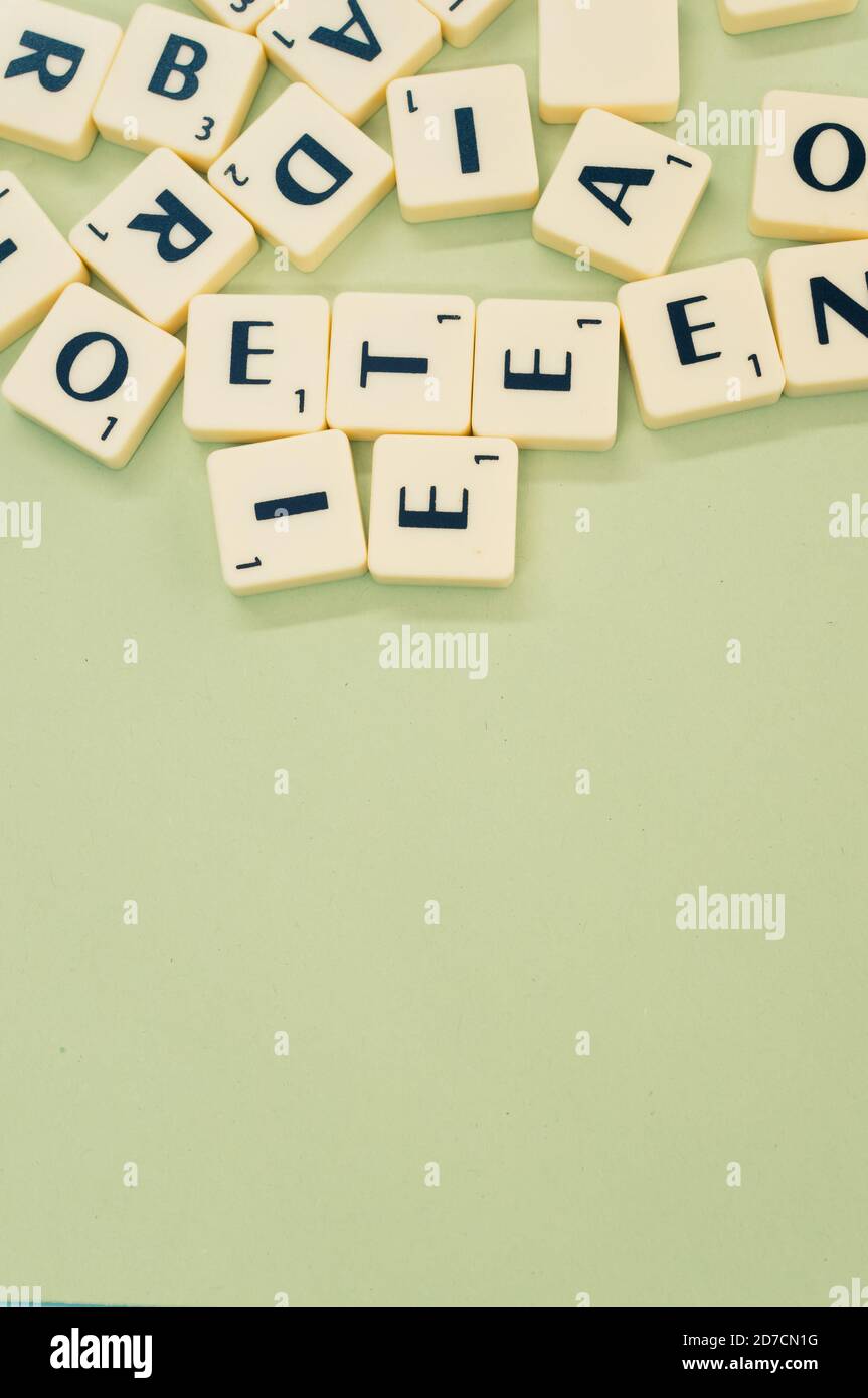 Top view of the alphabet letters on the wooden pieces on the green ...
