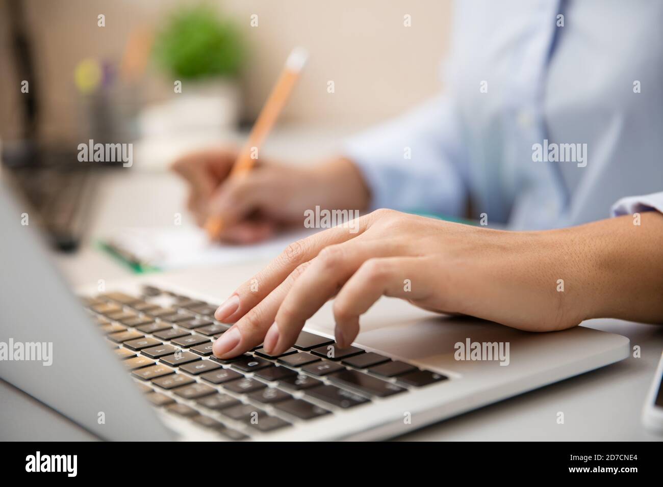 Close up of female hands typing. Remote working from home. Workplace in ...
