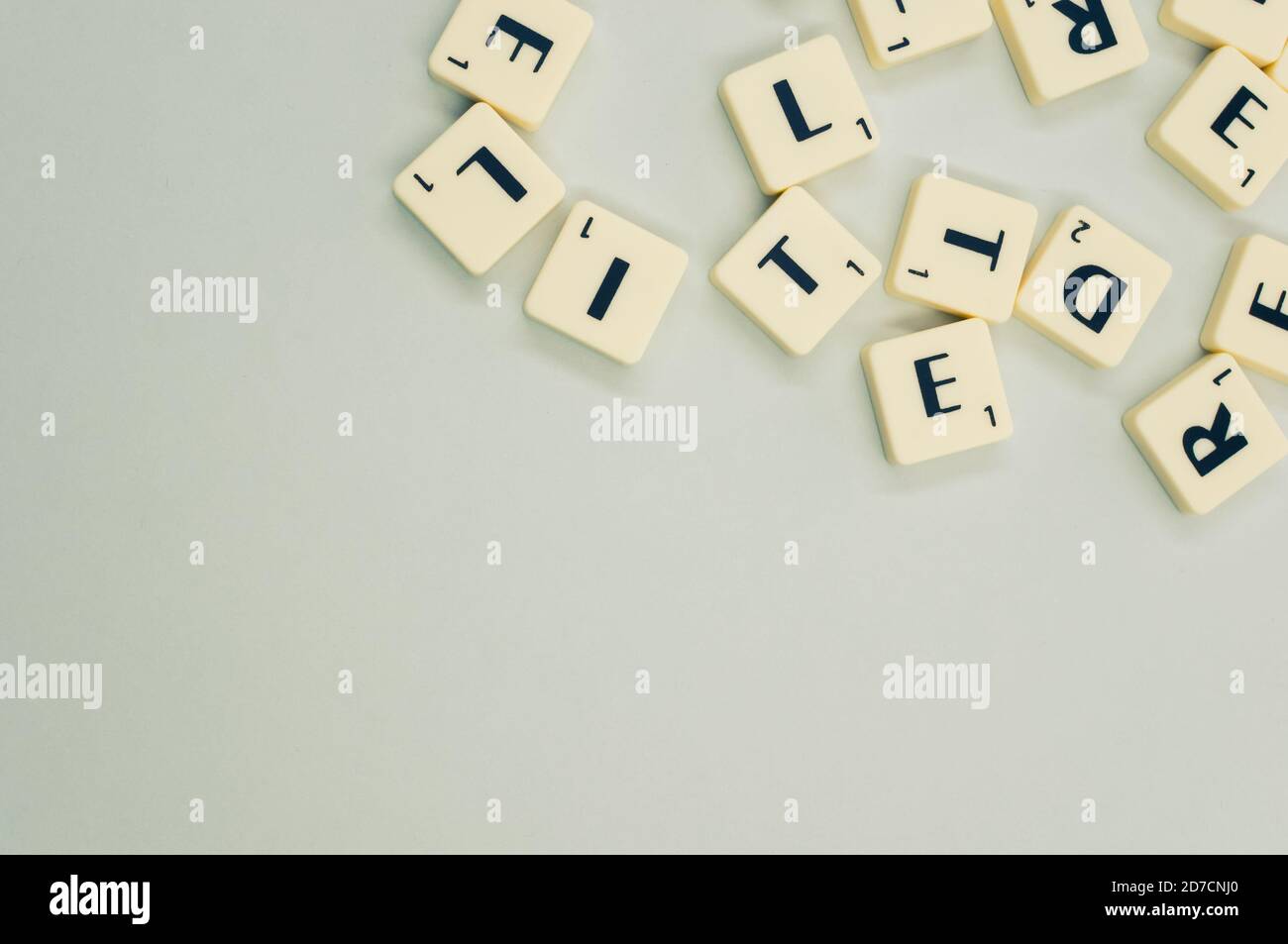 Top view of the alphabet letters on the wooden pieces on the gray ...
