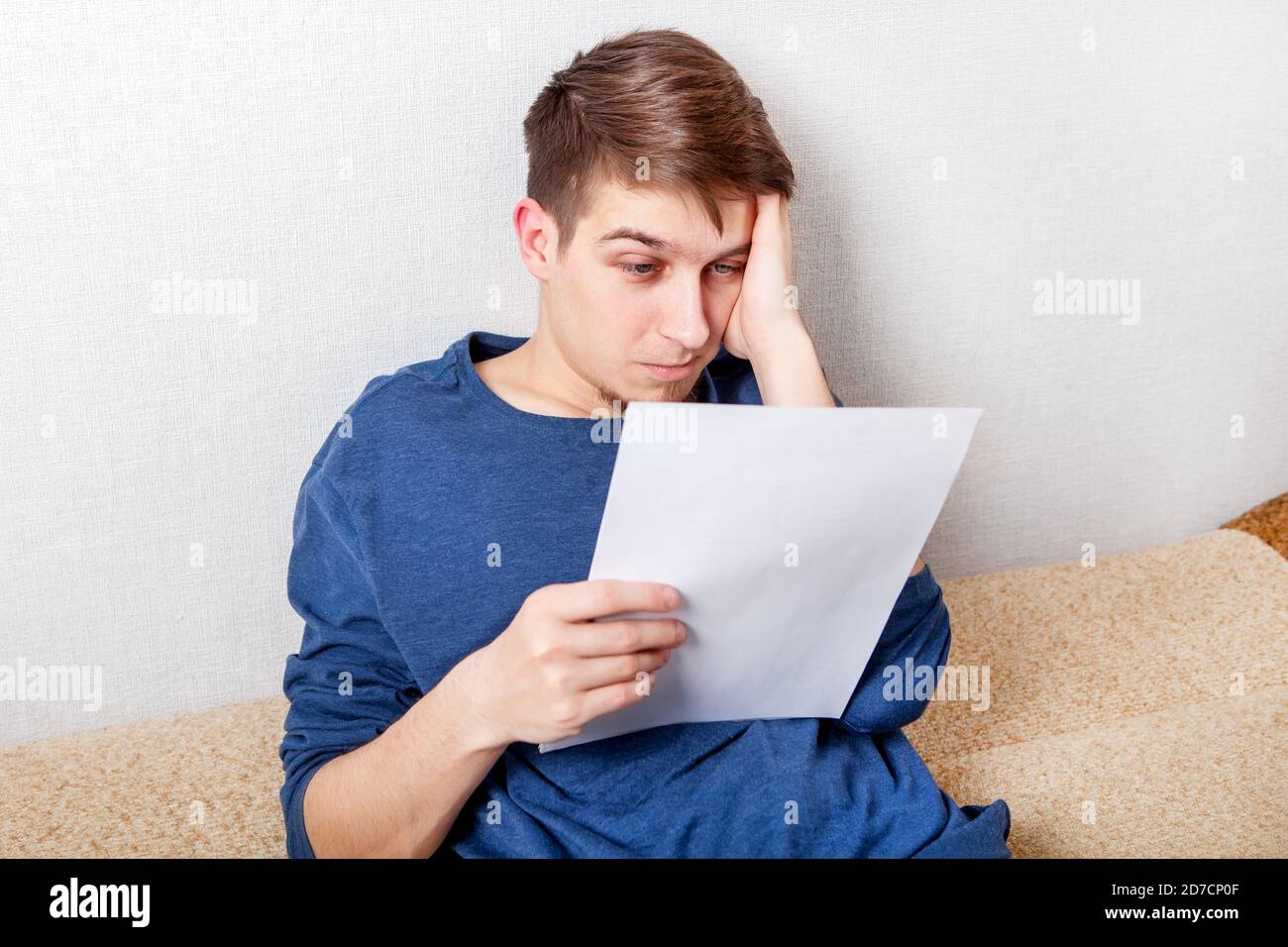 Young man read list hi-res stock photography and images - Alamy