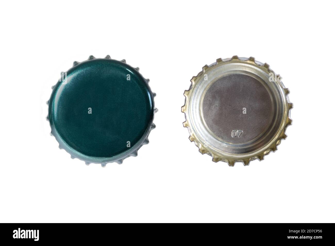 Shot of the top and bottom side of green metal bottle cap isolated on ...
