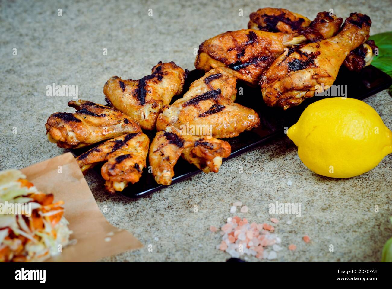 Fried chicken with lemon on side Stock Photo - Alamy
