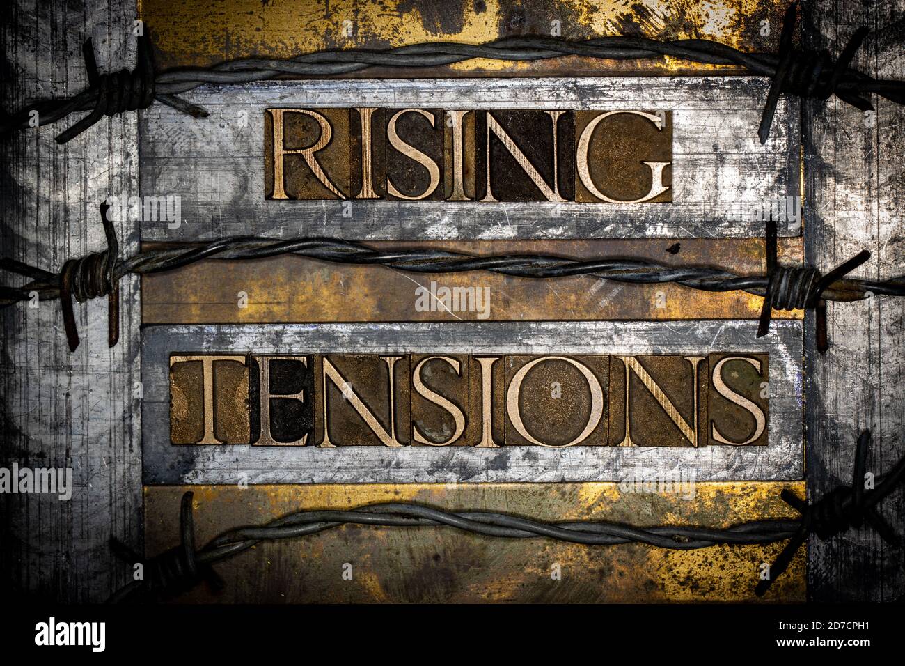 Rising Tensions text formed with real authentic typeset letters ...