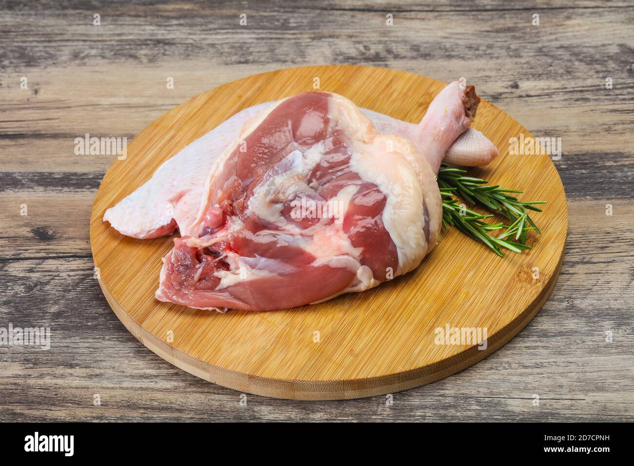 Raw duck leg served rosemary for cooking Stock Photo - Alamy