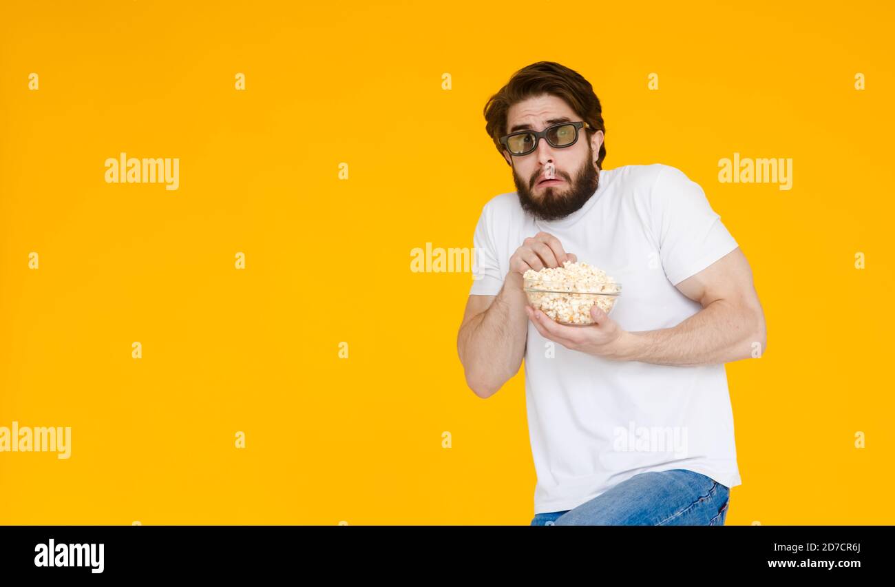 Portrait vogue young man in 3d glasses, white t-shirt watching movie ...