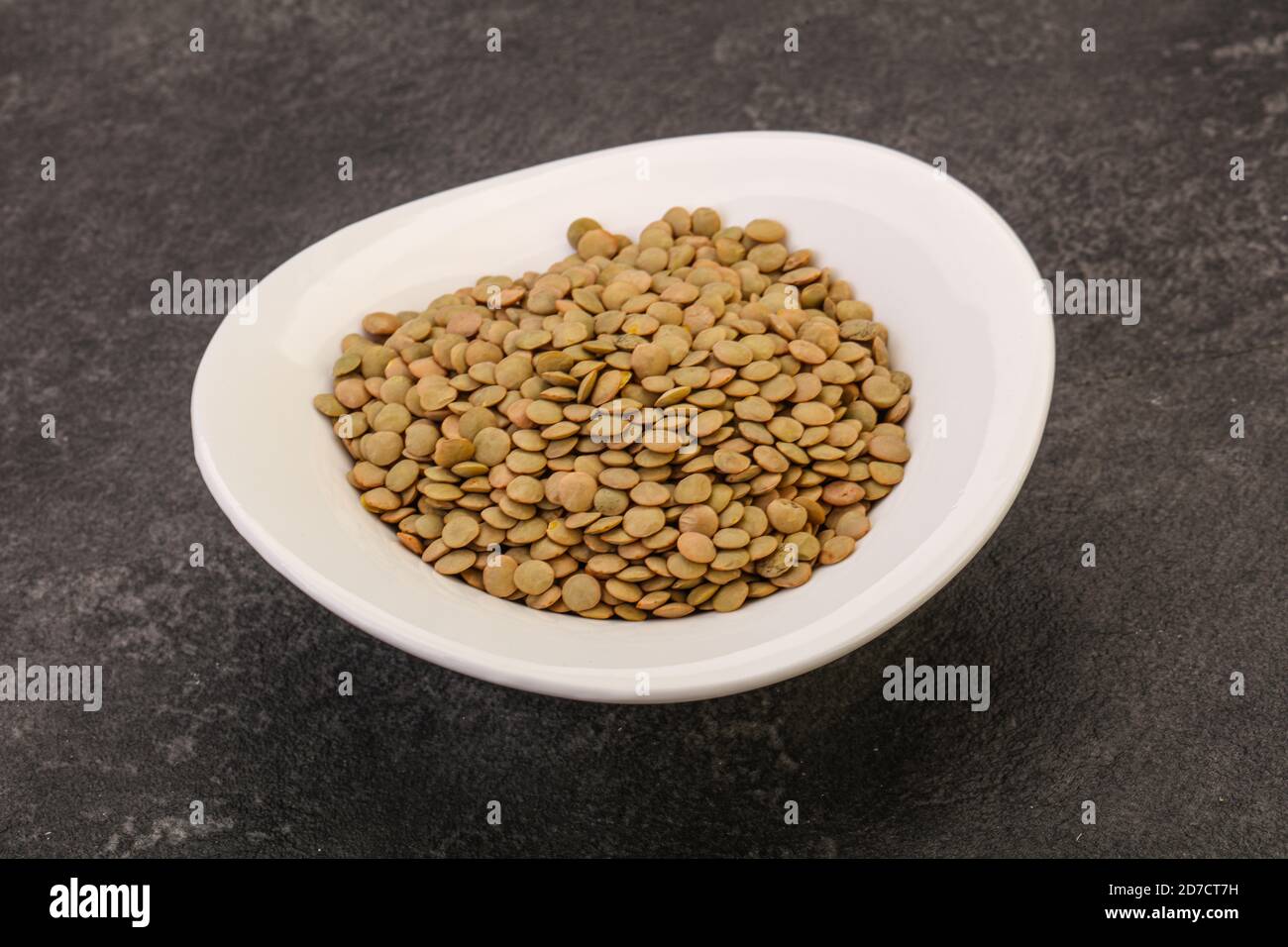 Vegan cuisine - Dry lentil heap isolated Stock Photo - Alamy