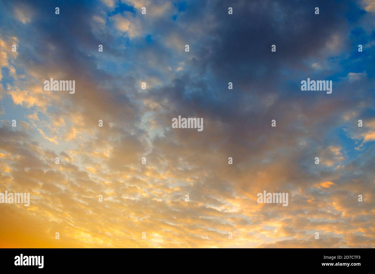 Beautiful colorful sunset sky background with the light of sun behind ...