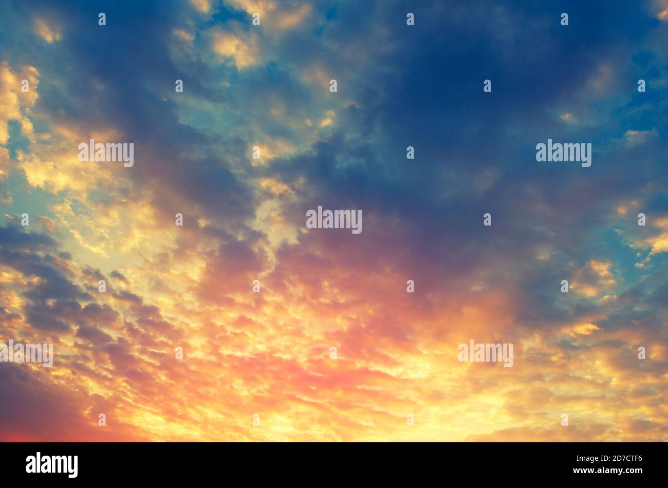 Beautiful colorful sunset sky background with the light of sun behind ...