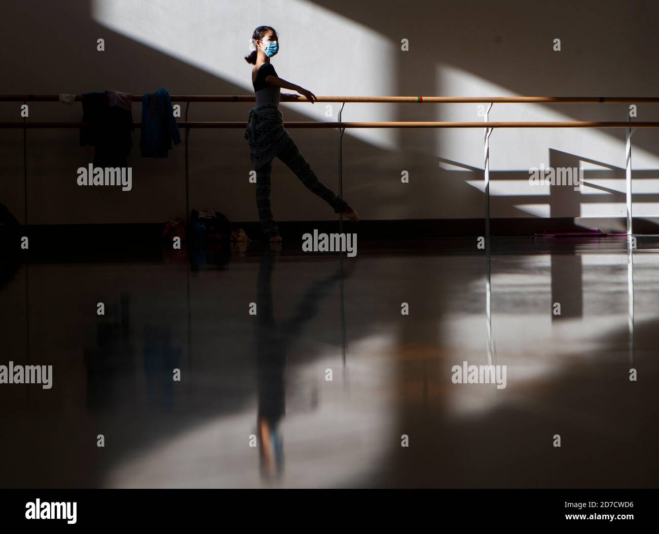 A dancer from the Northern Ballet wears a face covering during a ...