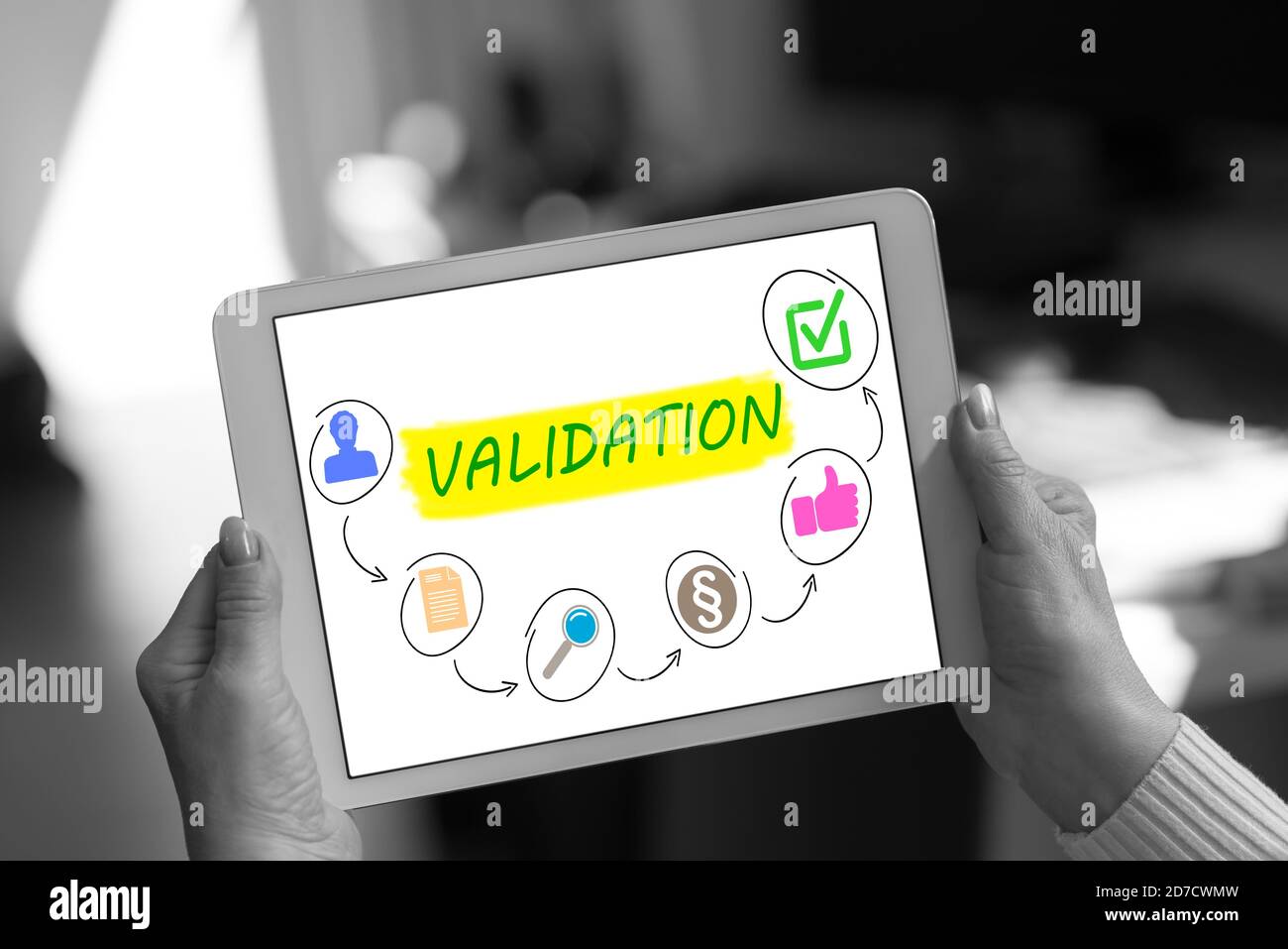 Validation concept shown on a tablet held by a woman Stock Photo - Alamy