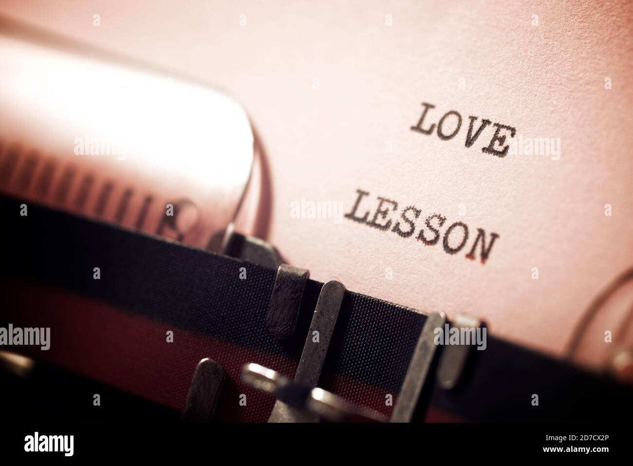 Love lesson phrase written with a typewriter Stock Photo - Alamy
