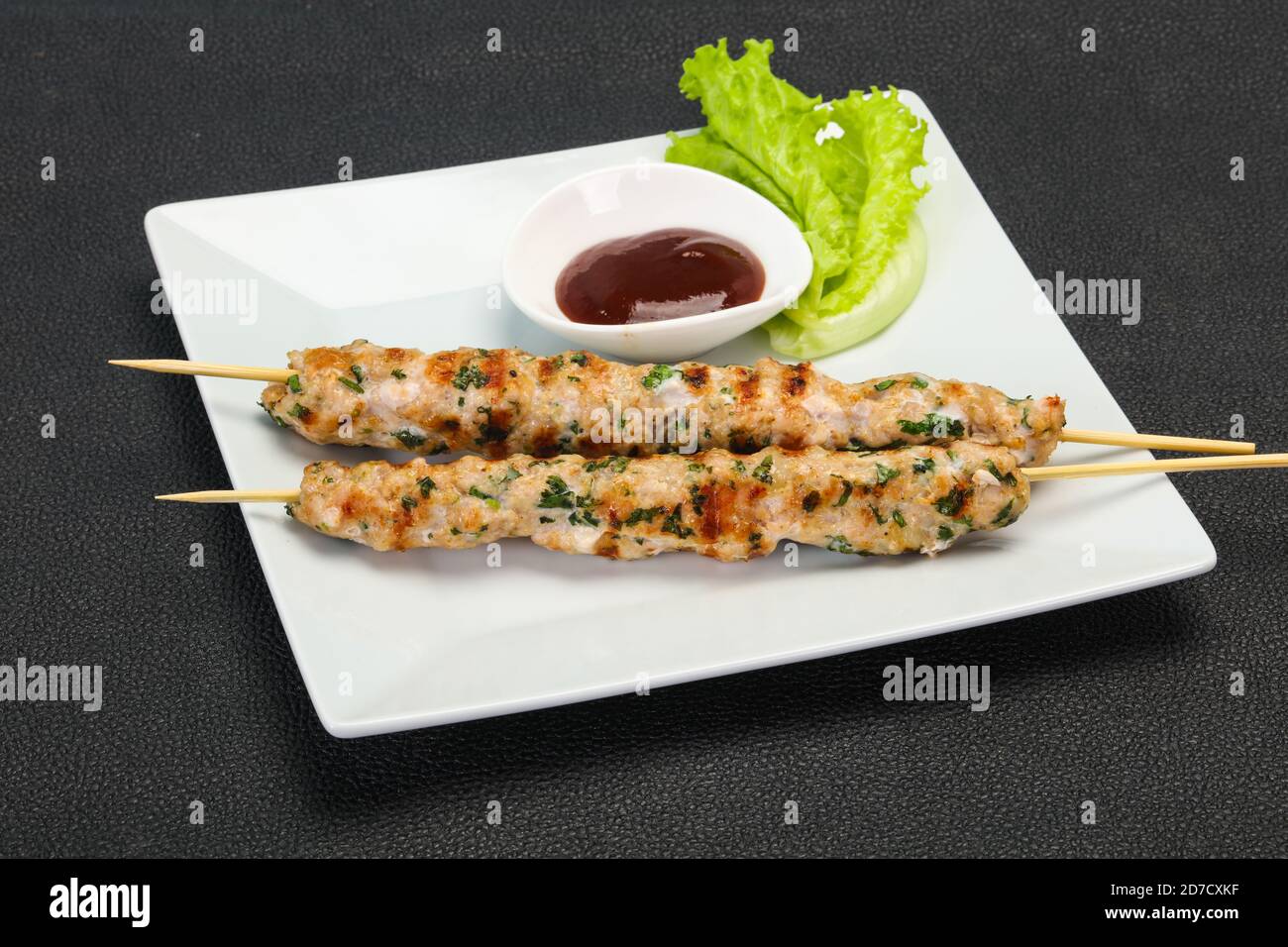 Minced pork skewer kebab with bbq sauce Stock Photo - Alamy