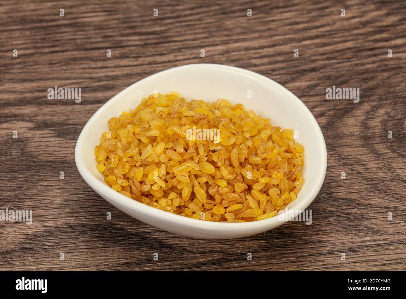 Vegetarian cuisine - dry bulgur for cooking in the bowl Stock Photo - Alamy