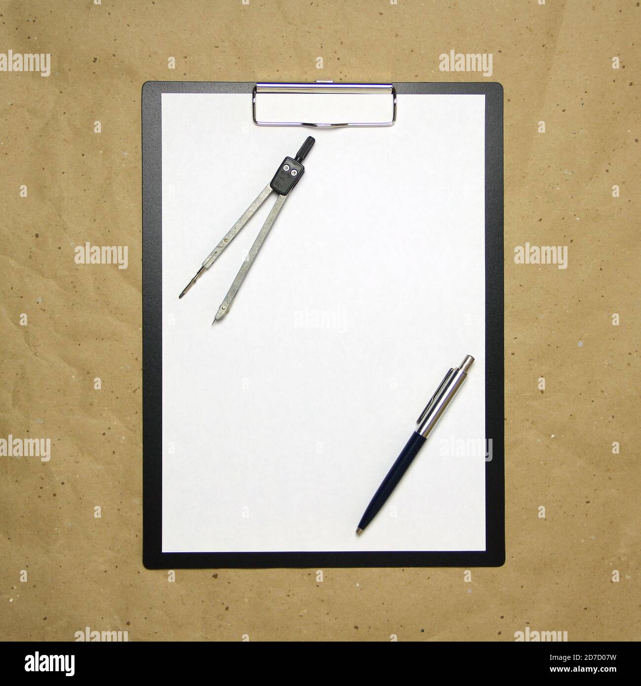 A tablet with a white sheet of A4 format on a beige craft paper. Stock ...