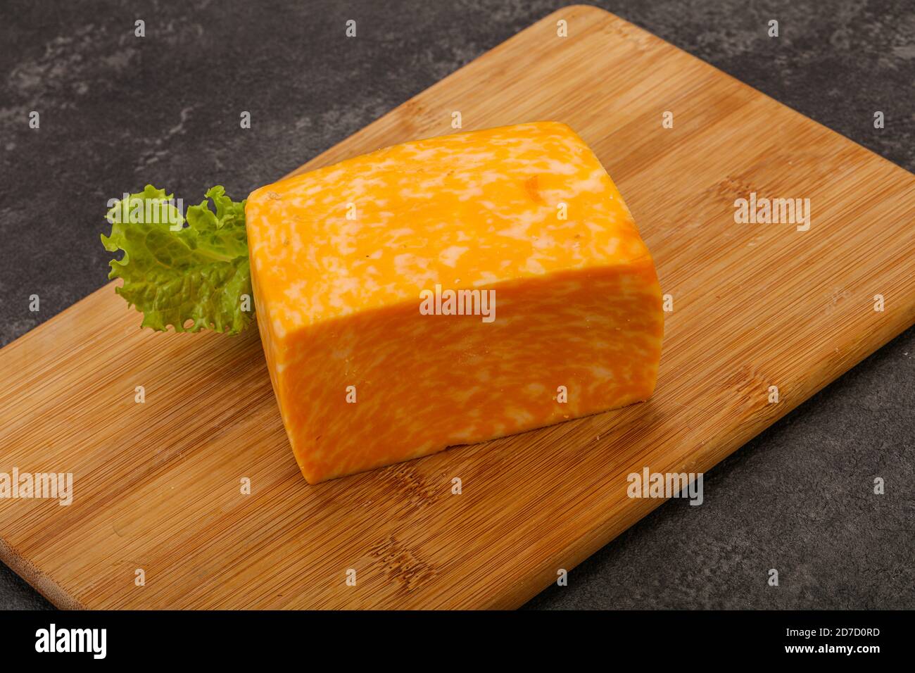 Dairy Marble cheese brick over board Stock Photo - Alamy