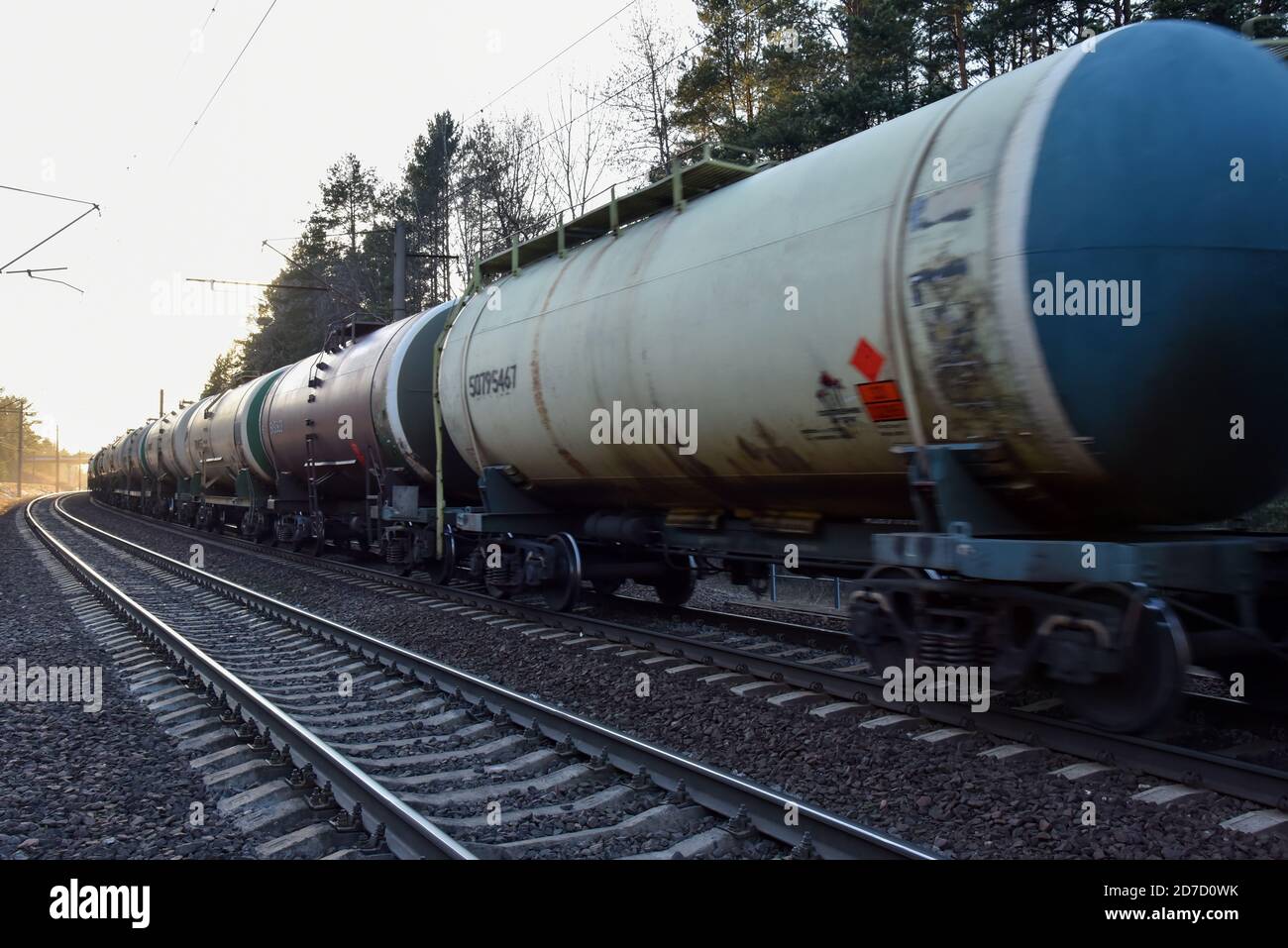 Freight train with petroleum tank cars on railroad. Rail cars carry oil ...