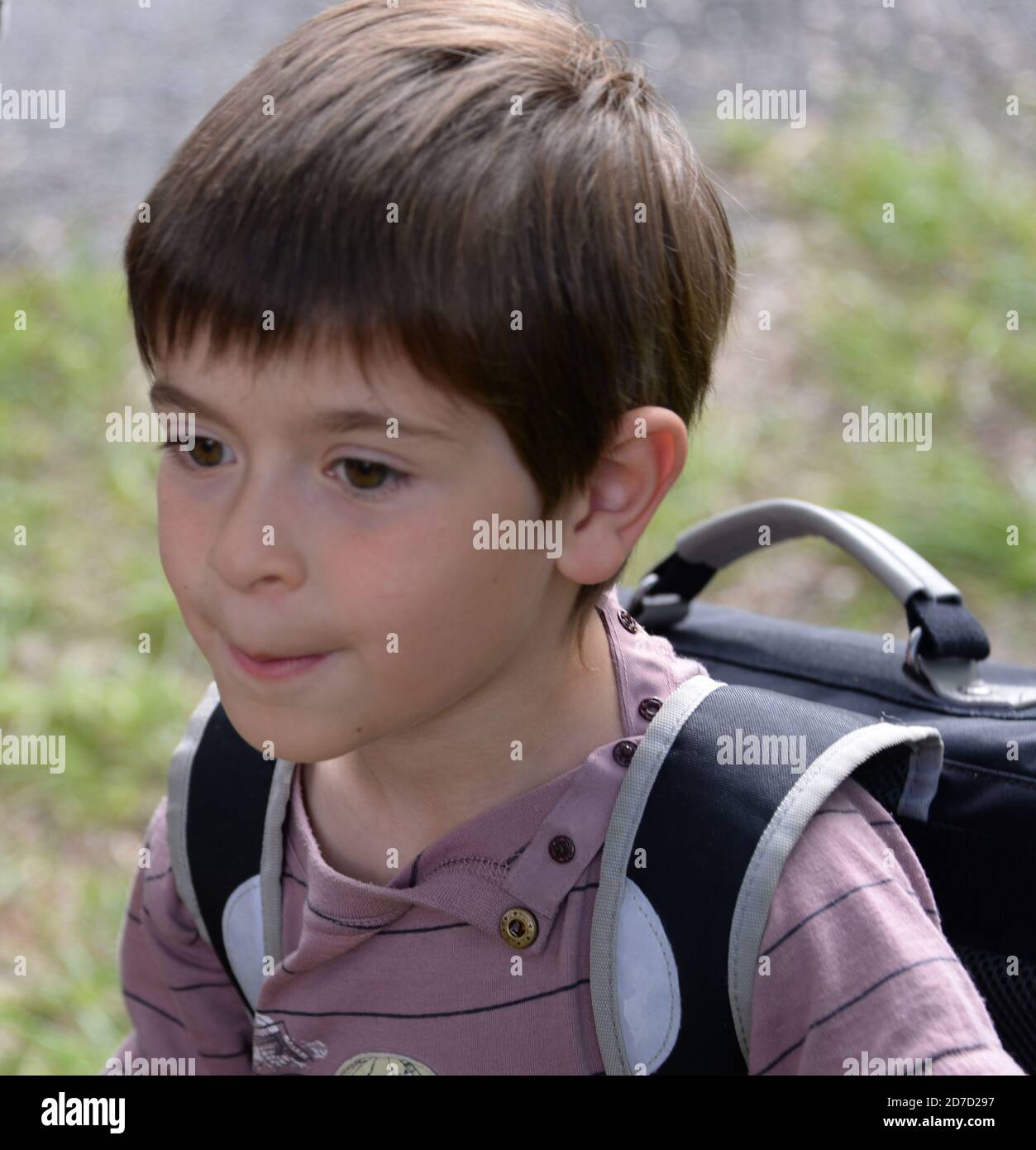 Little boy coming home from school with his schoolbag on his back Stock ...
