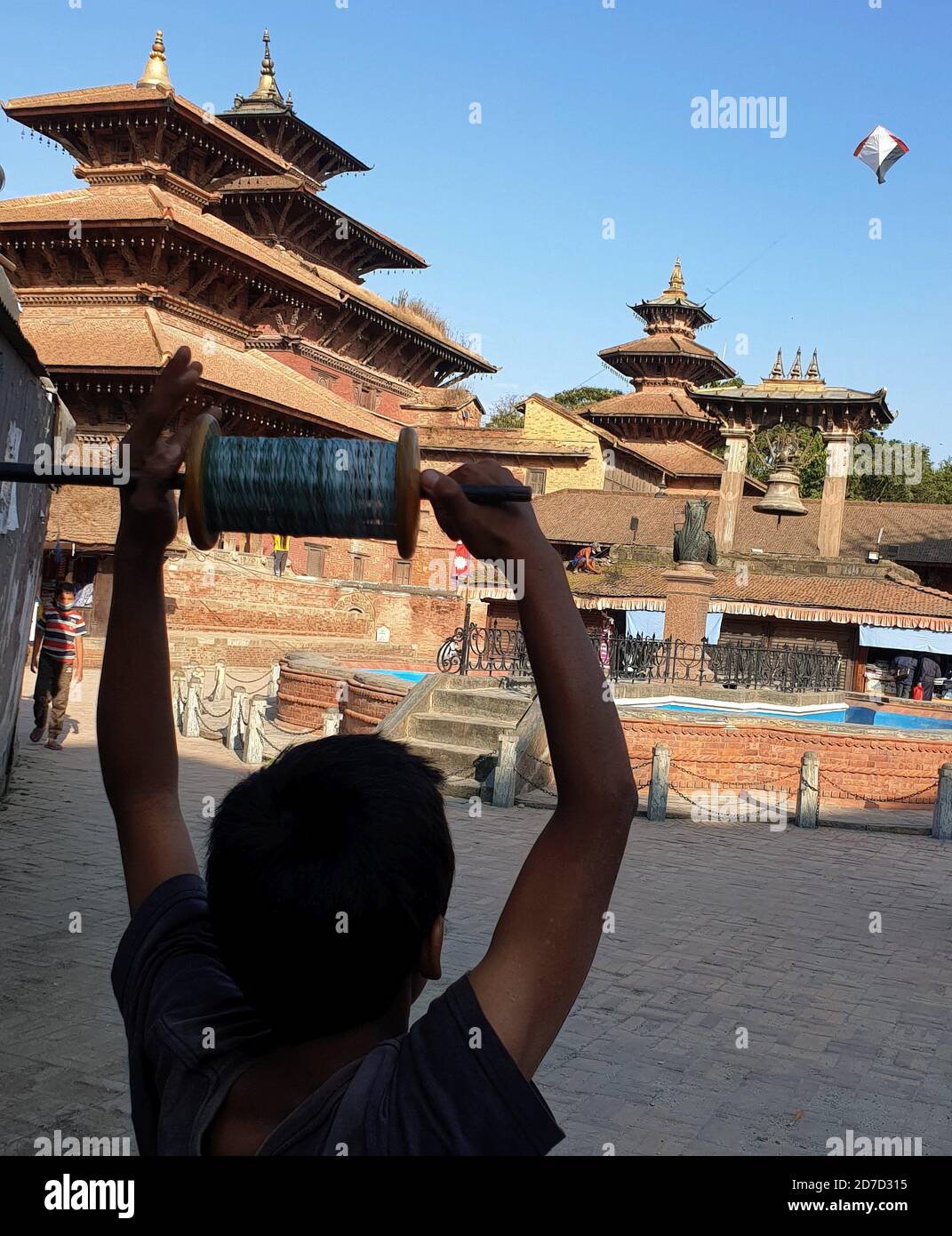Lalitpur, Nepal. 22nd Oct, 2020. A boy flies kite during Dashain ...