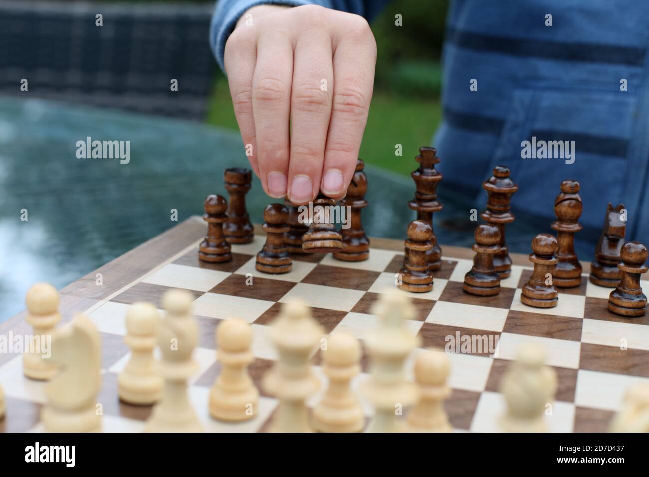 Hand moving chess pieces hi-res stock photography and images - Alamy