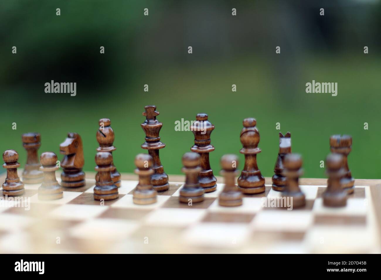 Chess pieces on chess board, outside, low depth of field, focus on ...