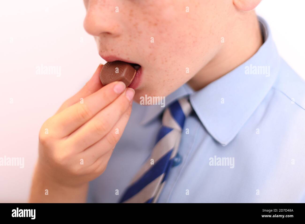 Boy eating orange crunch hi-res stock photography and images - Alamy