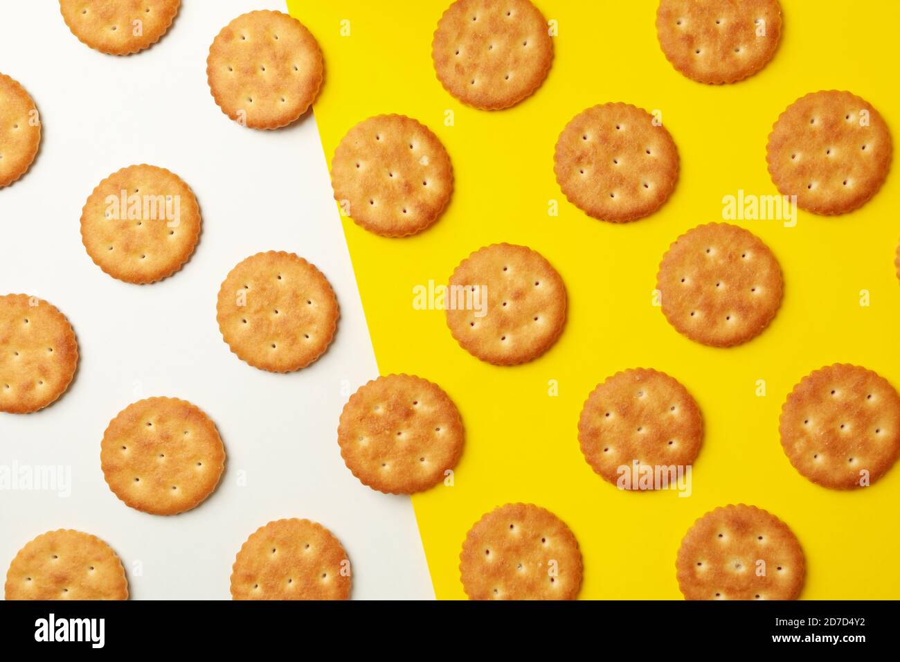 Flat lay with cracker biscuits on two tone background Stock Photo - Alamy