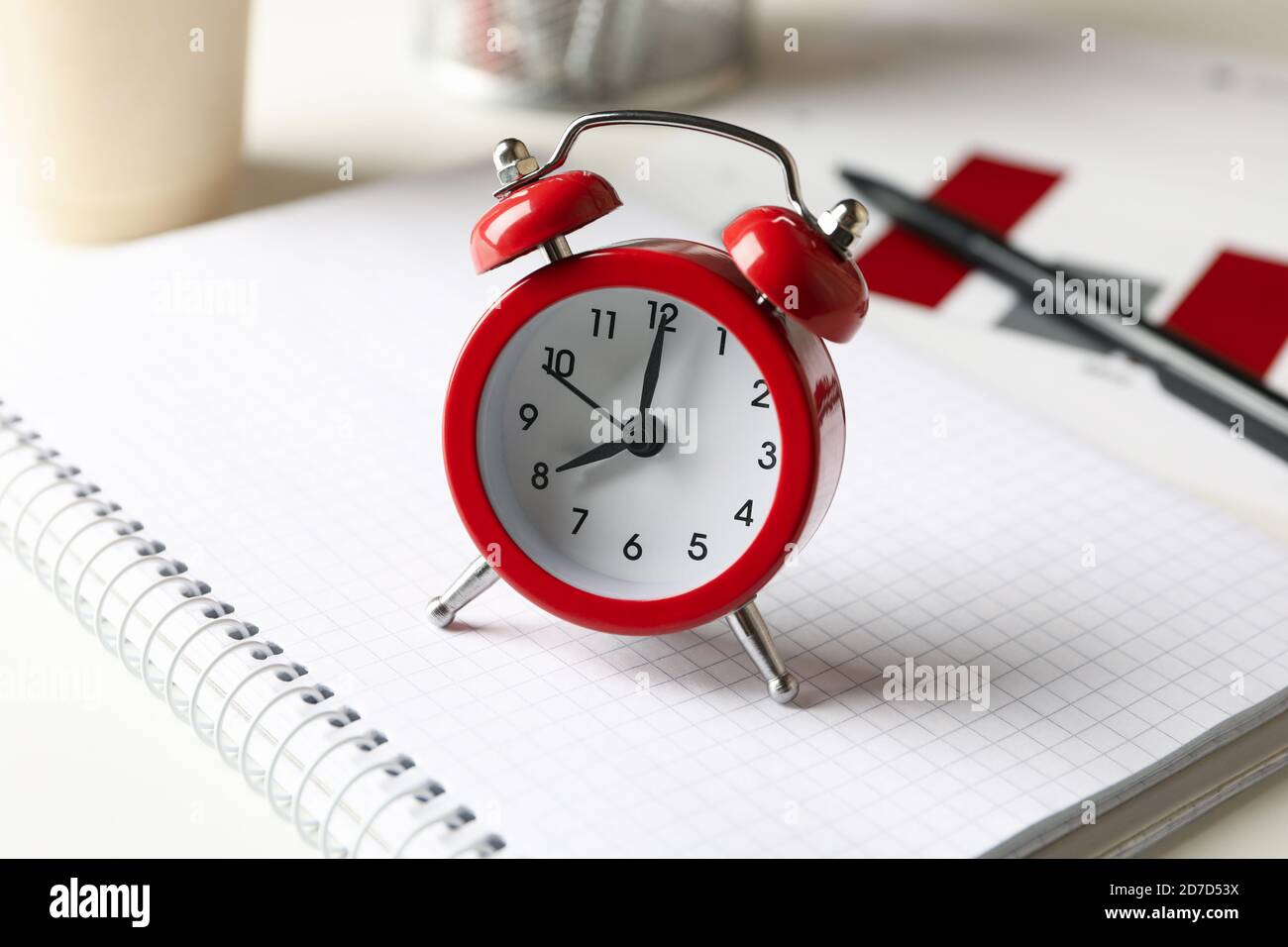 Concept of finance planning with alarm clock on white table Stock Photo ...