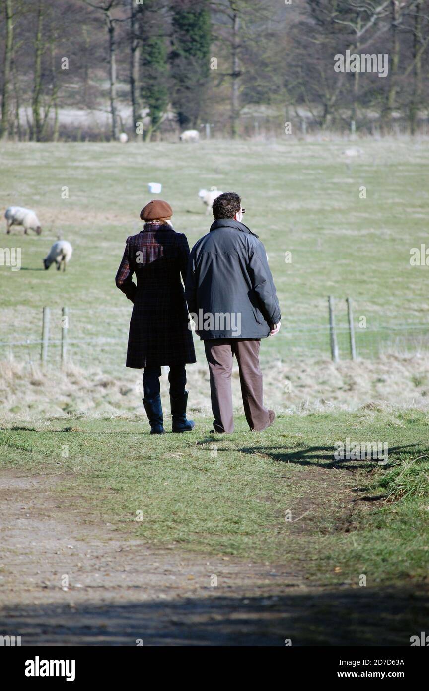 Couples walk in countryside Stock Photo - Alamy