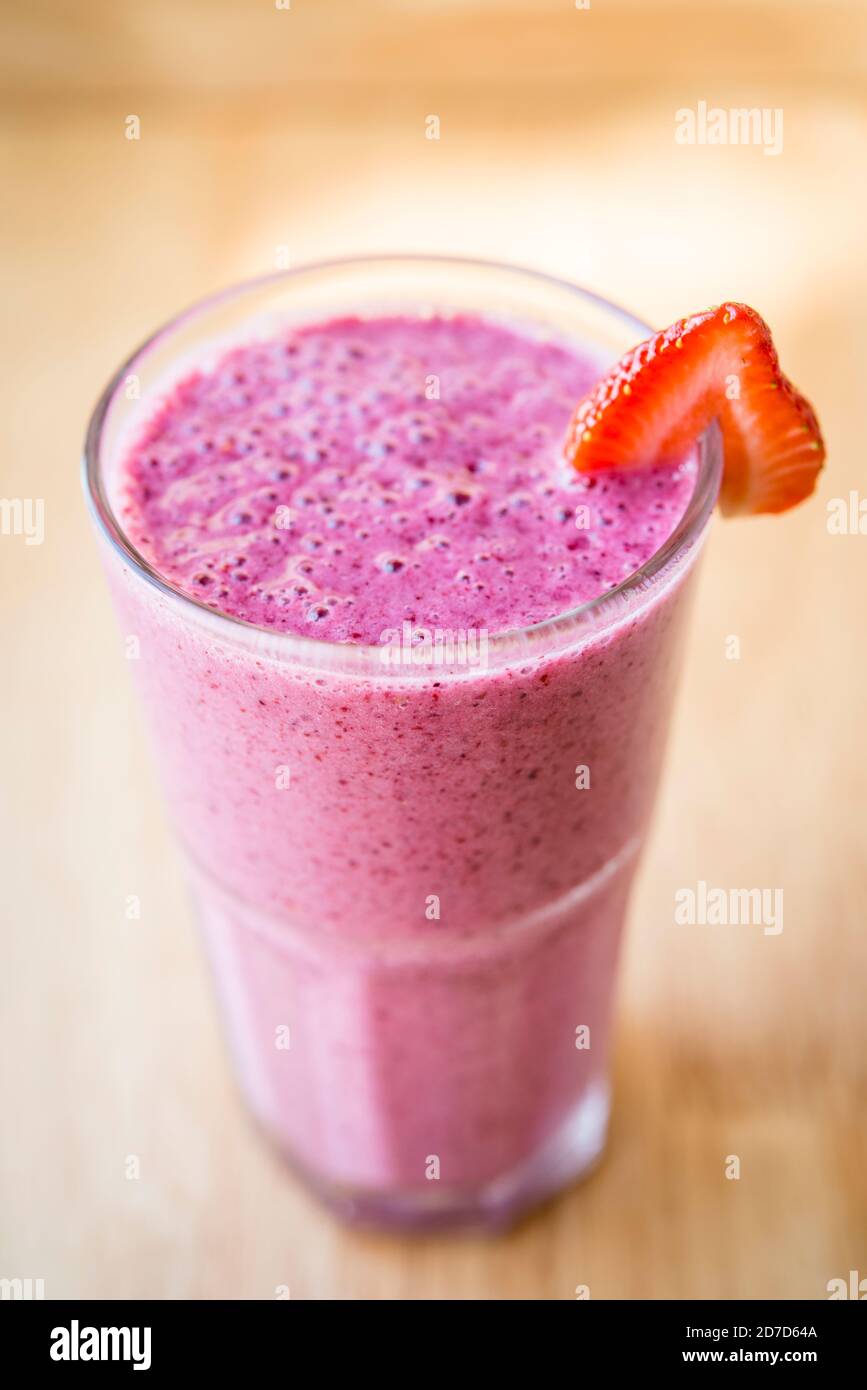 mixed berry Fruit shake with a heart shaped piece of watermelon on a ...