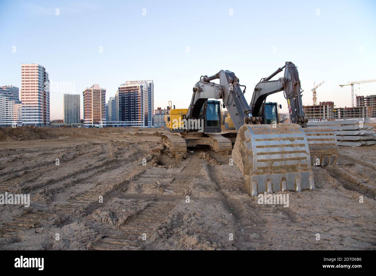 Group of the excavators for digging ground, trenching and foundation at ...