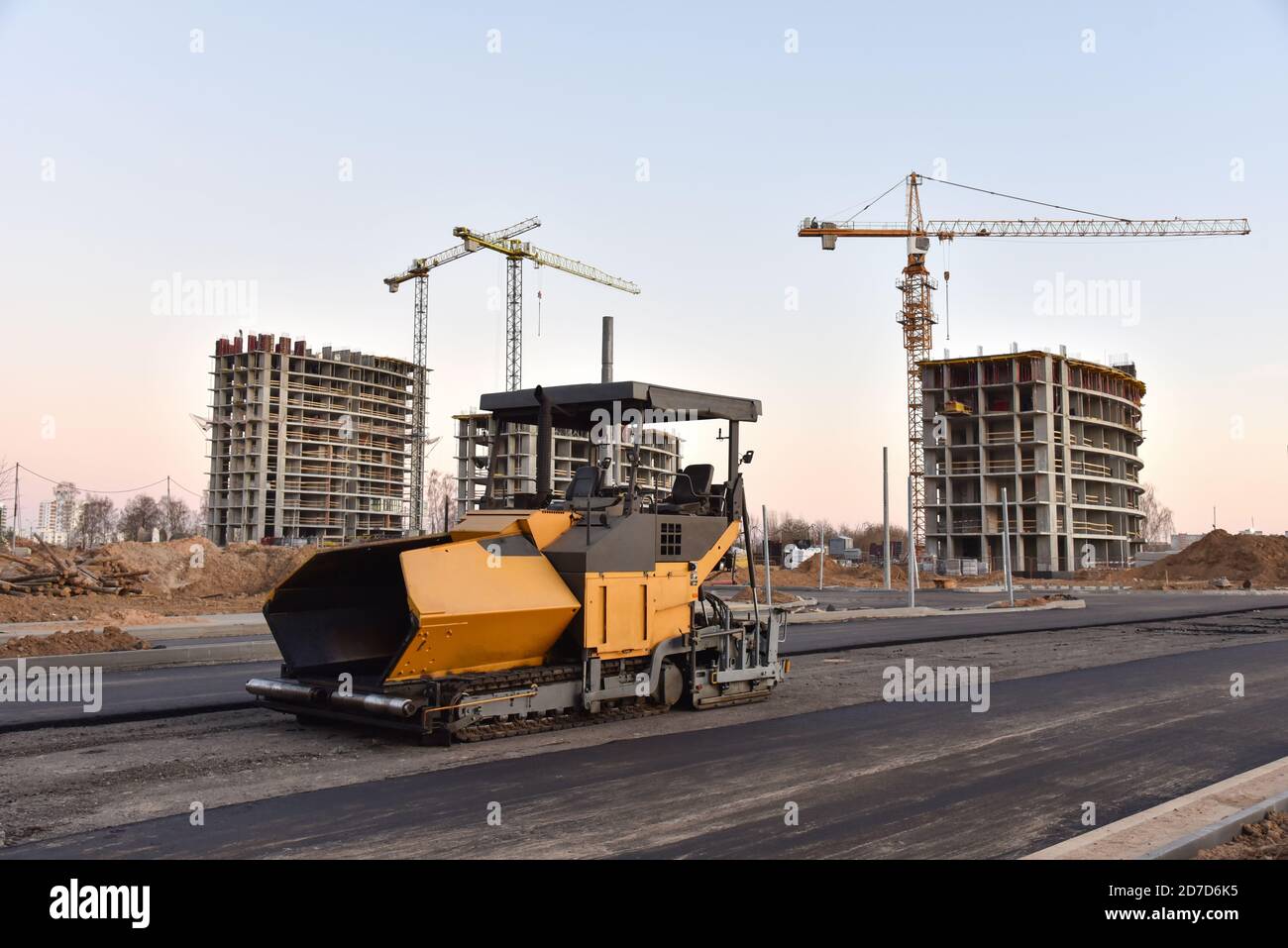 Asphalt paver machine during road works. Road Machinery at construction ...